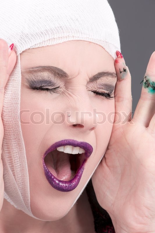 Picture of screaming wounded woman face ... | Stock image | Colourbox