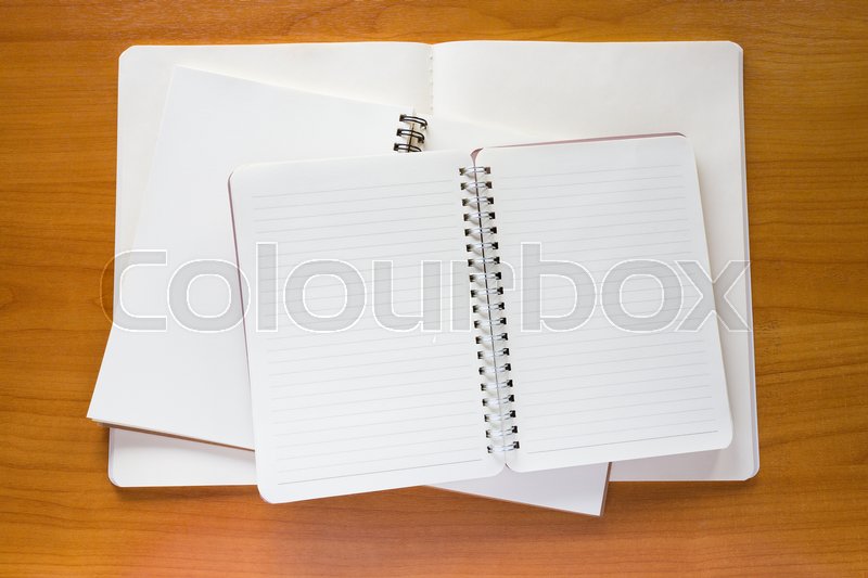 Stack of three empty white notebooks on ... | Stock image | Colourbox