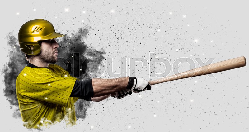 Baseball Player with a yellow uniform ... | Stock image | Colourbox