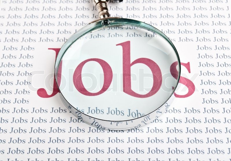 Job search with a magnifying glass ... | Stock image | Colourbox