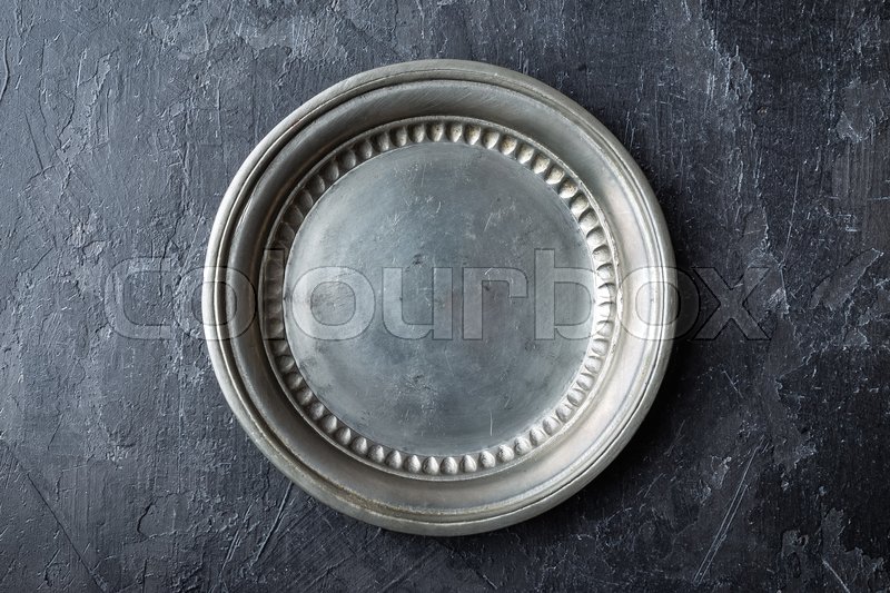 Empty metal plate on dark texture ... | Stock image | Colourbox