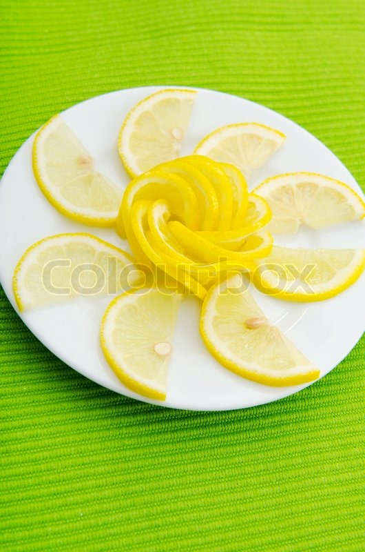 Lemon slices served in the plate | Stock image | Colourbox