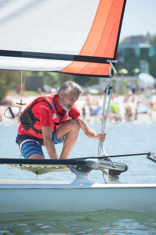 Professional waterman training on lake ... | Stock image | Colourbox