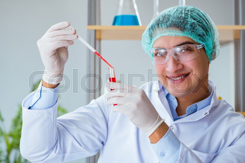 Young doctor working on blood test in ... | Stock image | Colourbox
