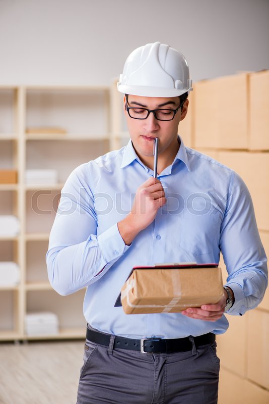 Young worker in the postal office ... | Stock image | Colourbox