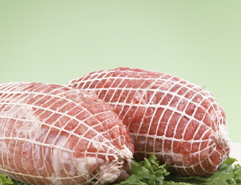 Two big pieces of fresh ham on green ... | Stock Photo | Colourbox