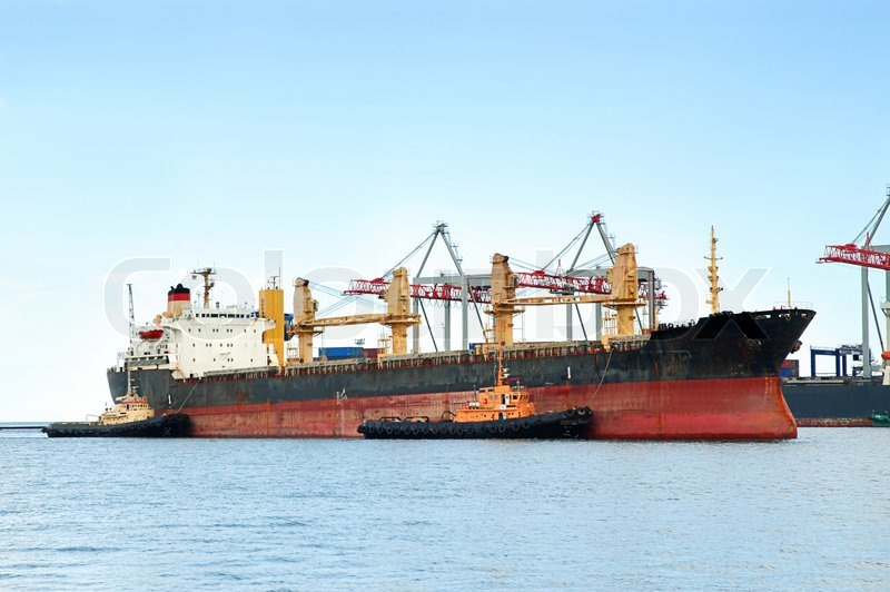 Container ship coming into port with ... | Stock image | Colourbox