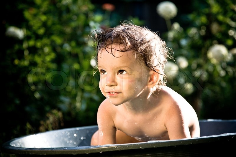 Outdoor baby bathing | Stock image | Colourbox