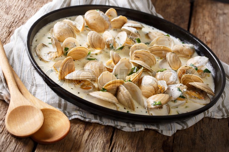 Delicious clams in a creamy sauce with ... | Stock Photo | Colourbox