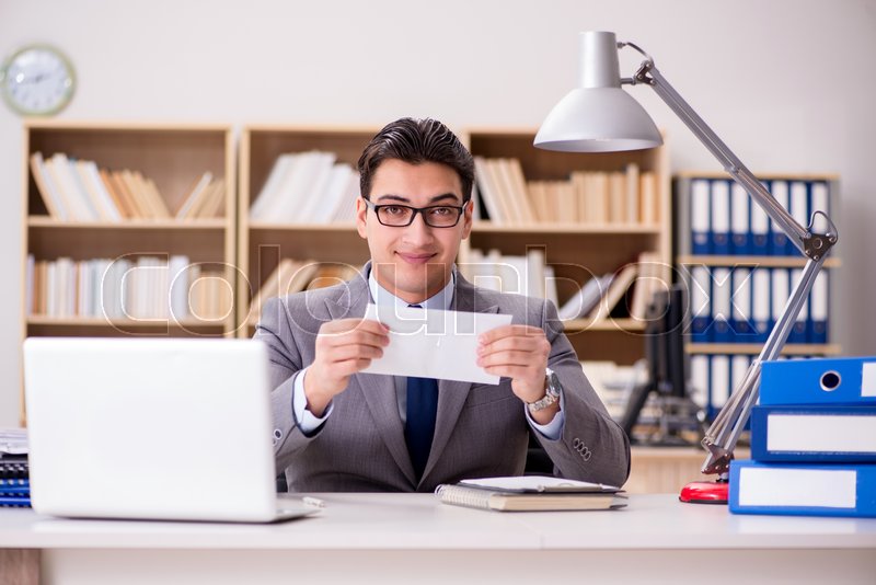 Businessman receiving letter in the ... | Stock image | Colourbox