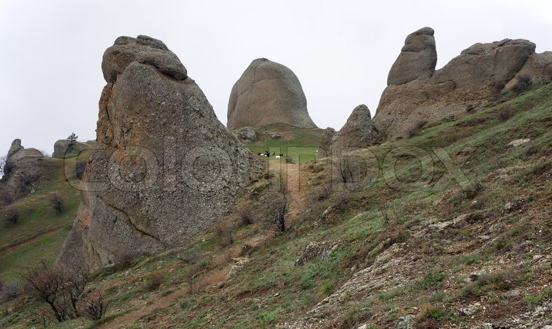Rocky mountain dull day view with goats ... | Stock image | Colourbox