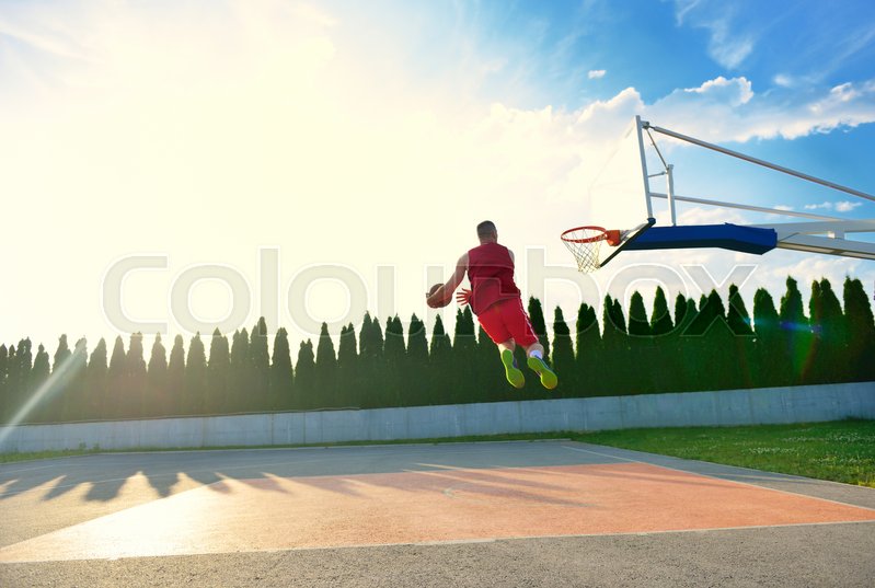 A young basketball player flying ... | Stock image | Colourbox