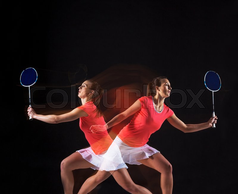 Young woman playing badminton over ... | Stock image | Colourbox