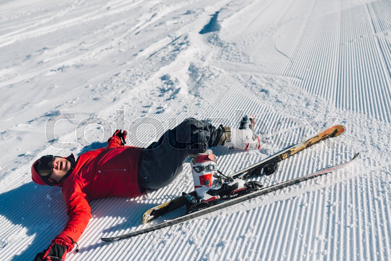 Competitor fell while skiing and ... | Stock image | Colourbox