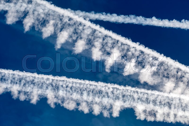 The contrails of several aircraft ... | Stock image | Colourbox