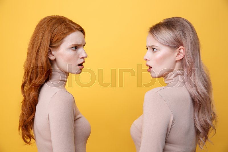 Side view picture of confused young two ... | Stock image | Colourbox