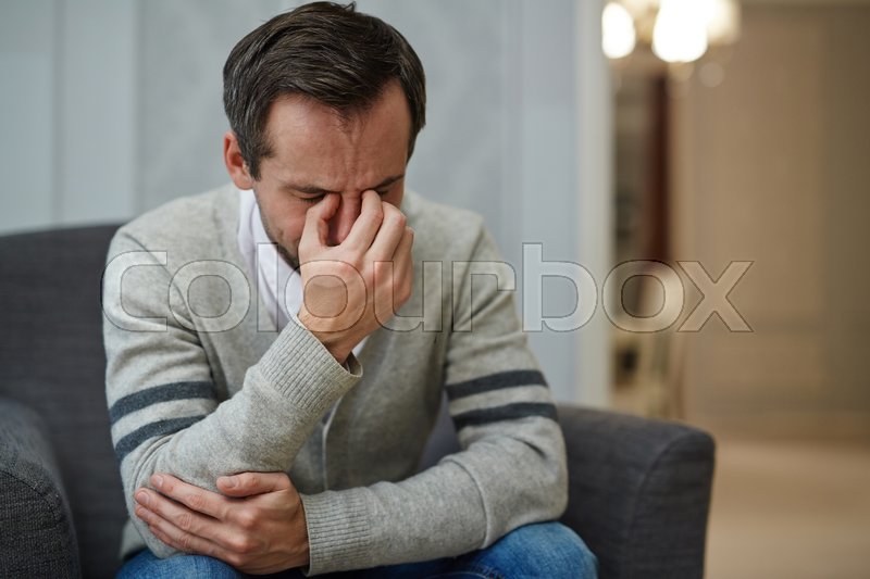 Desperate man crying during ... | Stock image | Colourbox