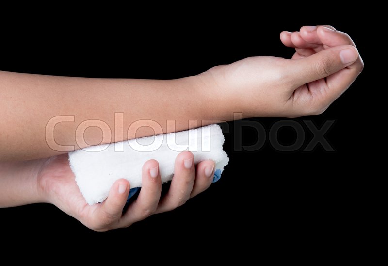 Woman applying cold fabric on arm after ... | Stock image | Colourbox