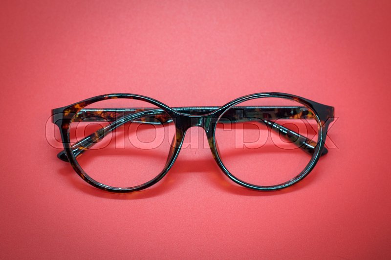 Modern fashionable spectacles on red ... | Stock image | Colourbox