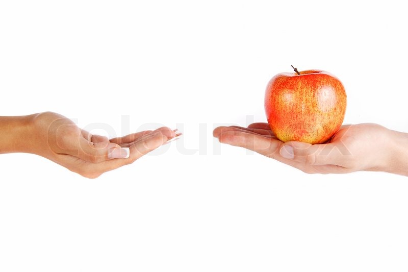 Mans hand is giving an apple to the ... | Stock image | Colourbox