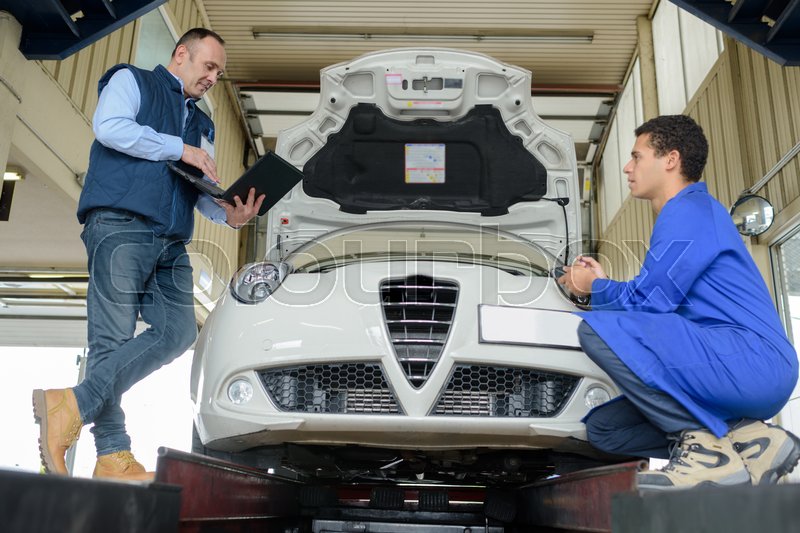 Men inspecting car | Stock image | Colourbox
