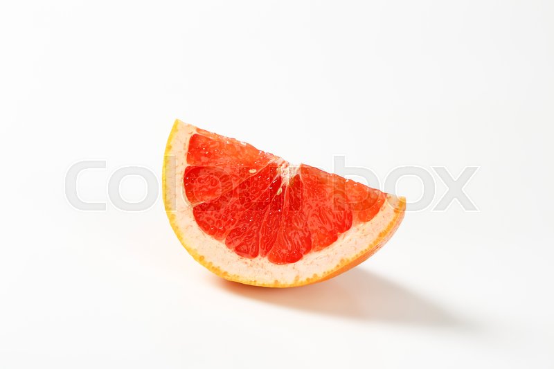 Wedge of fresh red grapefruit | Stock image | Colourbox