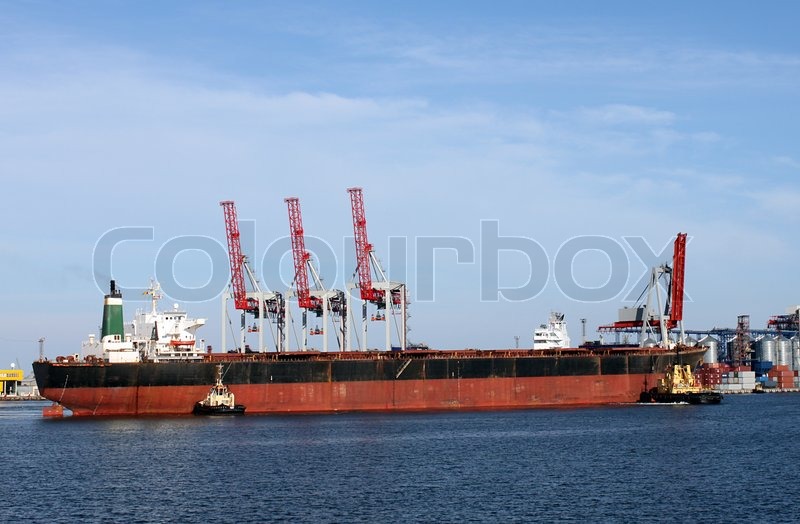 Dry cargo ship in a seaport | Stock Photo | Colourbox