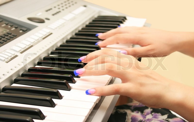 Woman playing professional keyboard. | Stock image | Colourbox