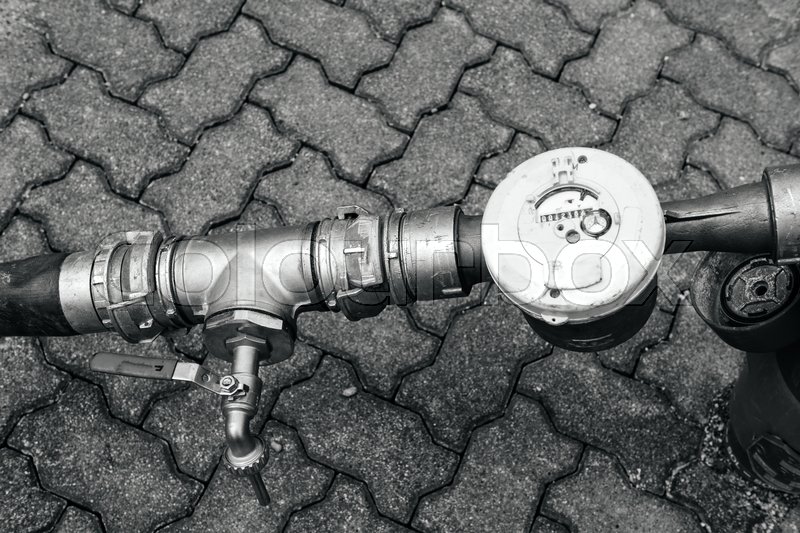 Water counter in urban enviroment at ... | Stock image | Colourbox
