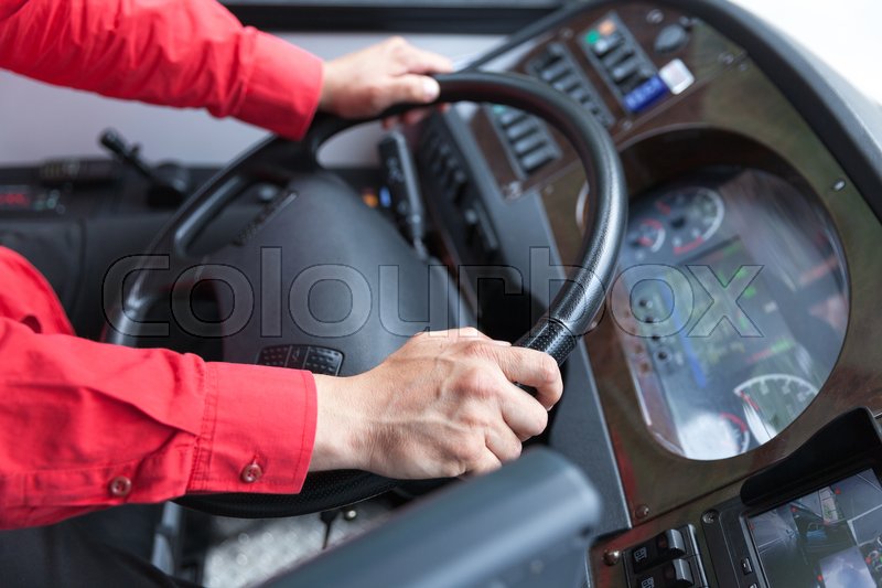 Hand close up of couch driver driving ... | Stock image | Colourbox