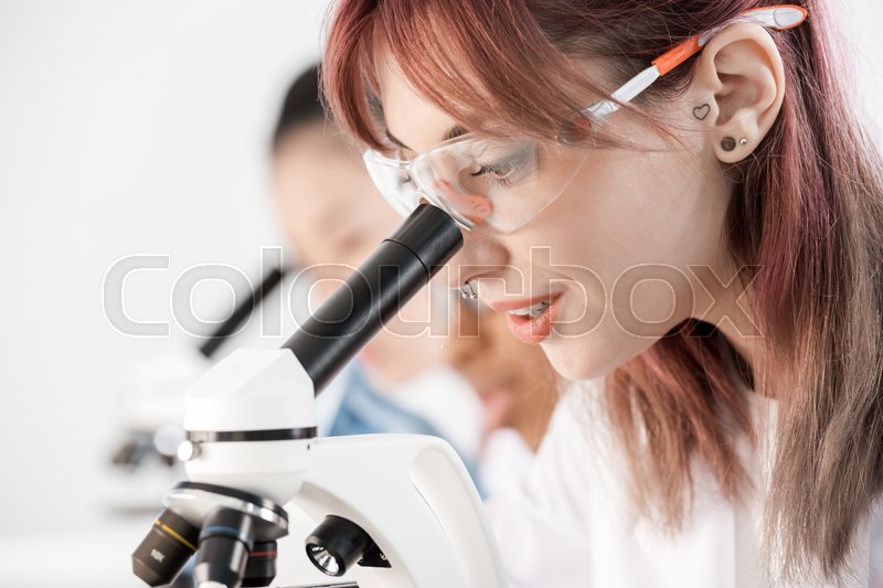 Side view of young scientist in ... | Stock image | Colourbox