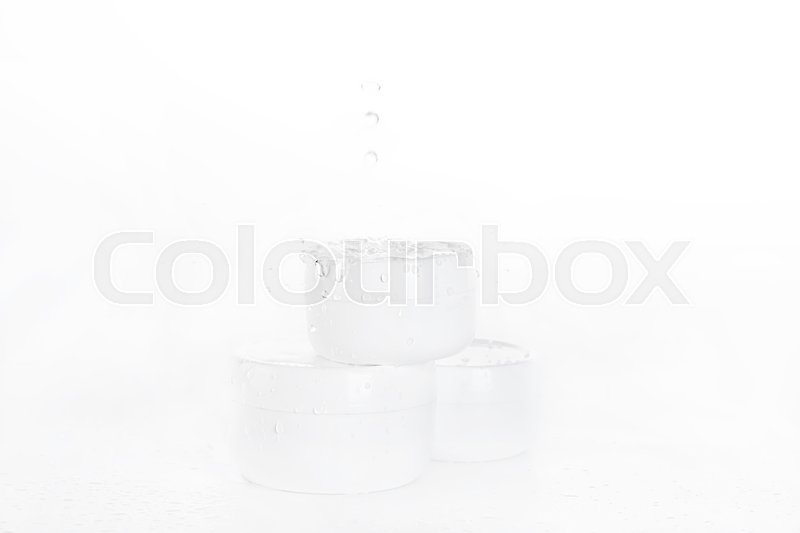 Water drops falling on heap of boxes ... | Stock image | Colourbox