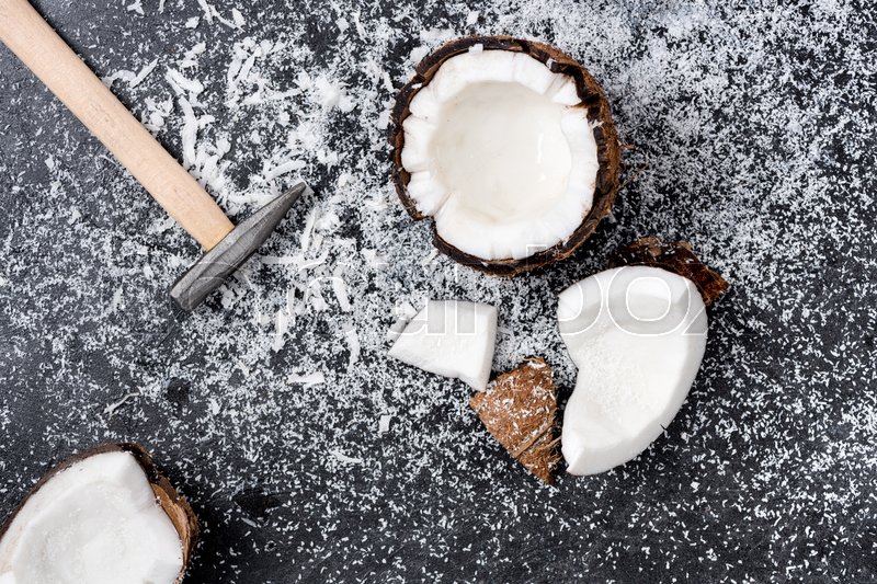 Top view of fresh broken coconut with ... | Stock image | Colourbox
