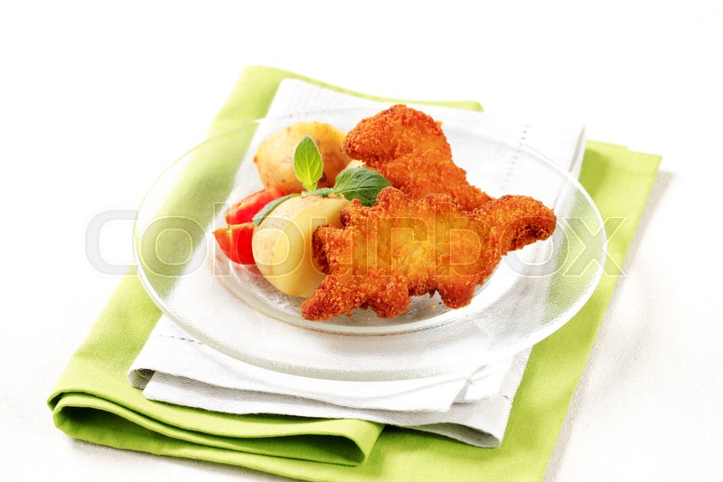Fried dinosaur-shaped fish nuggets with ... | Stock image | Colourbox