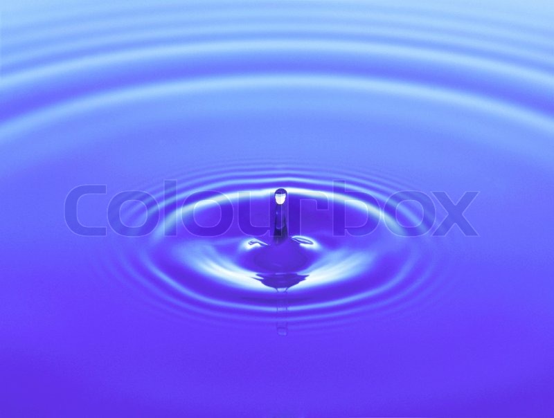 Droplet falling in water close up ... | Stock image | Colourbox