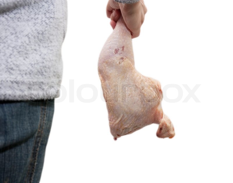 Chicken leg in hand | Stock image | Colourbox