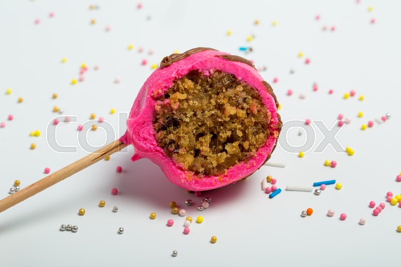 Cake pop Bitten isolated lying on white ... | Stock image | Colourbox