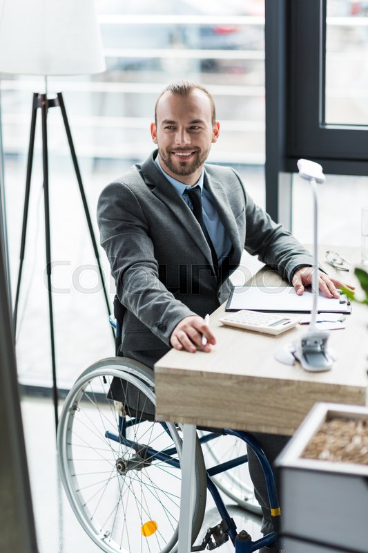 Smiling physically handicapped ... | Stock image | Colourbox