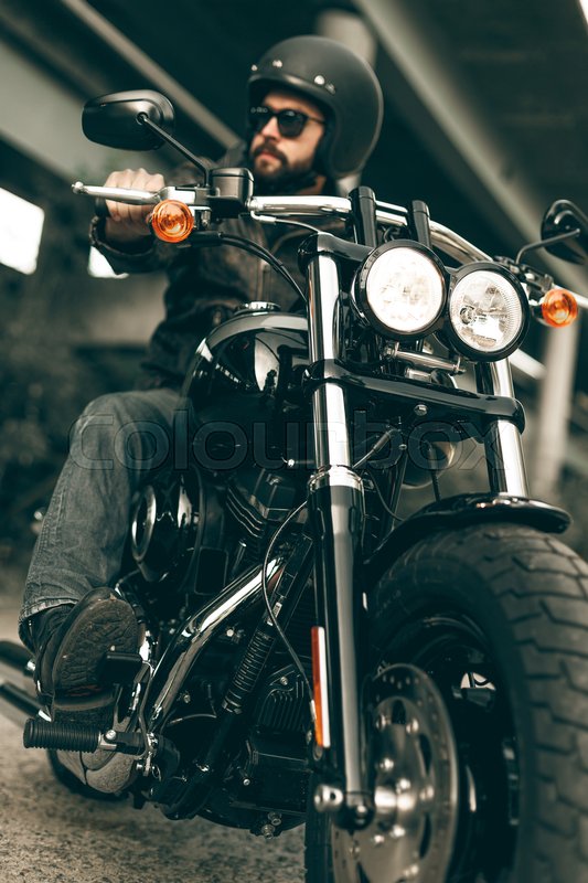 Biker in helmet and his style ... | Stock image | Colourbox
