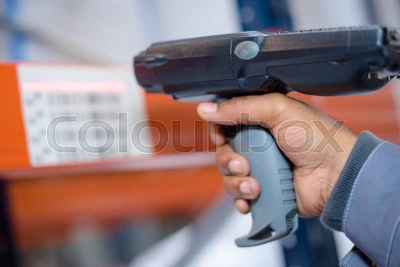 Close-up of hand using barcode scanner | Stock image | Colourbox