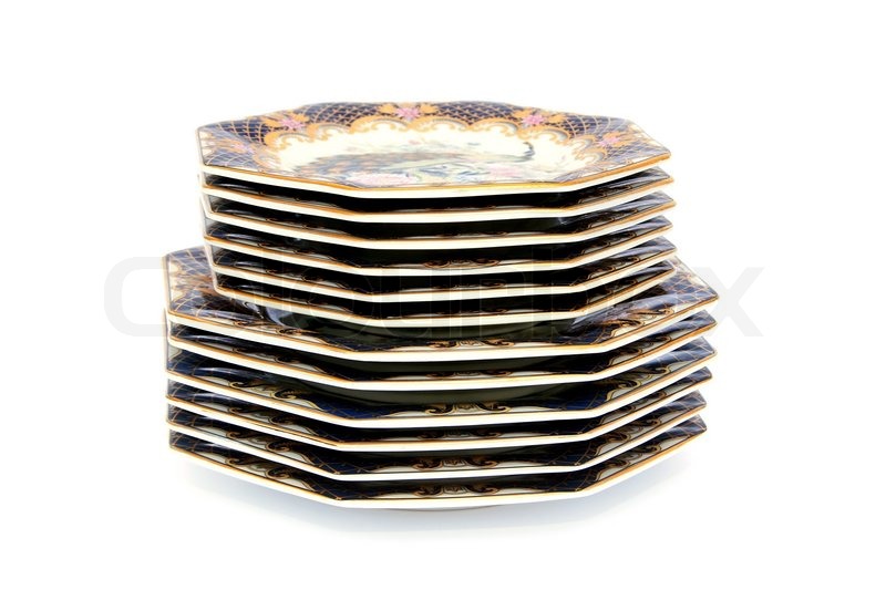 Stack of plates isolated on white ... | Stock image | Colourbox