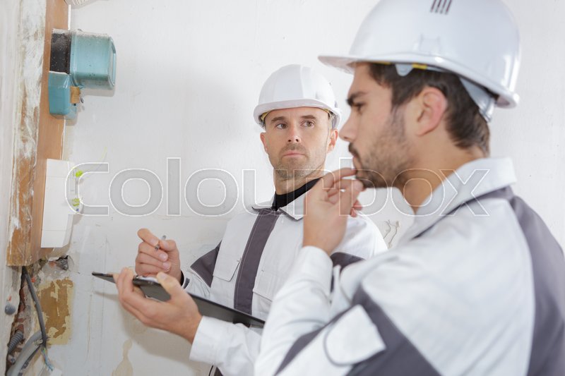 Professional electrician installing ... | Stock image | Colourbox