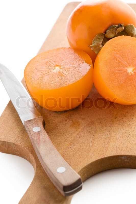 Photo shot of cut persimmon fruit | Stock image | Colourbox