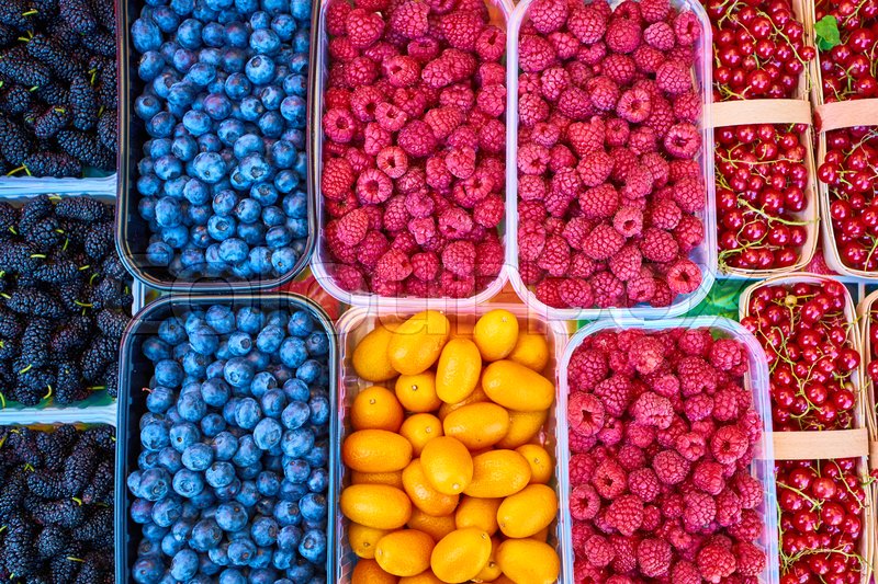 Baskets of berries in a market. mixed ... | Stock Photo | Colourbox