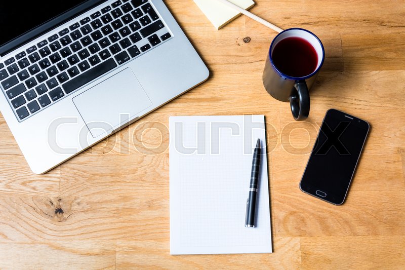 Work environment with a laptop, ... | Stock image | Colourbox