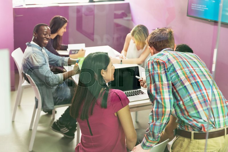 Teacher explaining the lesson to his ... | Stock image | Colourbox