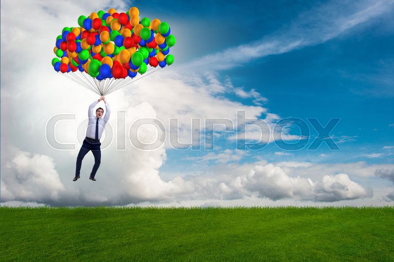 Businessman flying balloons on bright ... | Stock image | Colourbox