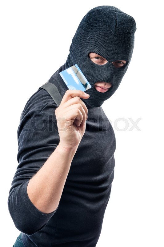 Hacker in black clothes with a bank ... | Stock image | Colourbox