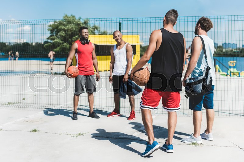 Basketball team discussing new game ... | Stock image | Colourbox