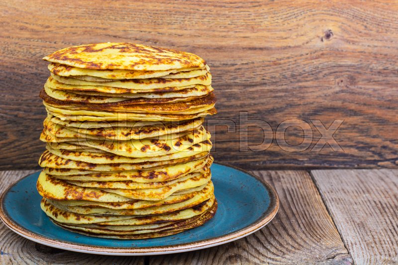 High stack of pancakes in rustic style. ... | Stock Photo | Colourbox